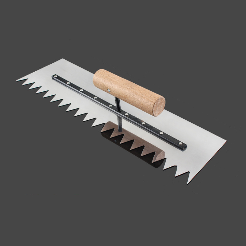 Murarz i tynkarz używający kielni, typ 20, lewa zębata końcówka ...